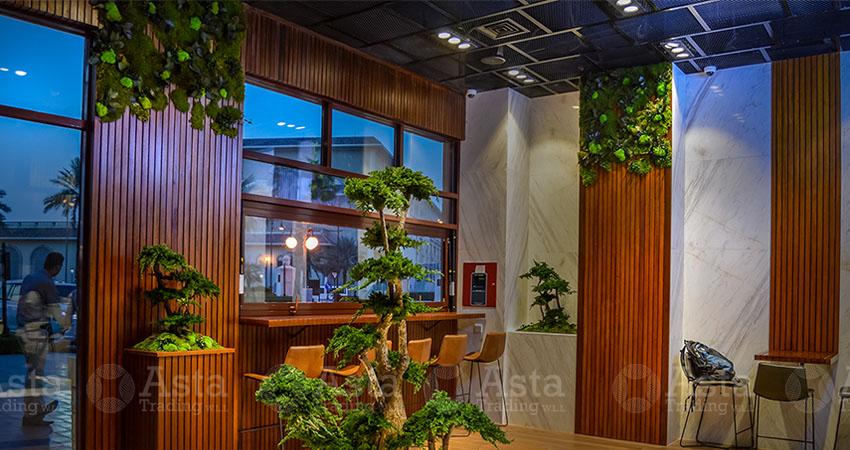 Indoor Lanscape with Preserved TreesGraze Café | Asta Trading W.L.L.